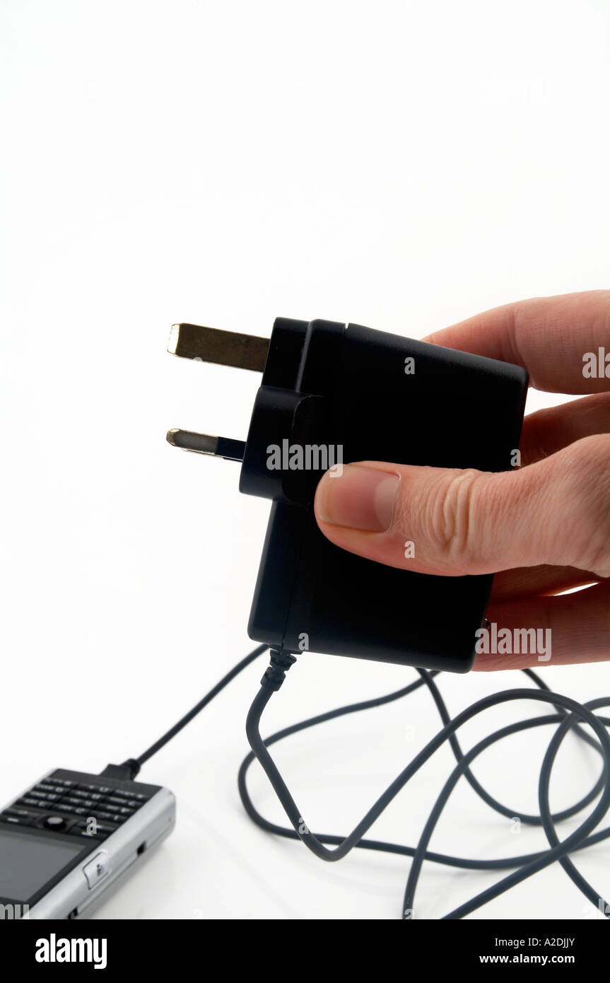mobile phone with charger Stock Photo - Alamy