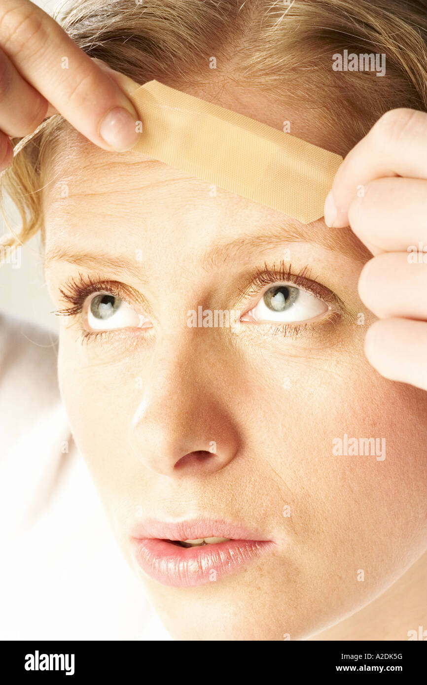 1205741 indoor studio young woman blonde 25 30 forehead head brow ...