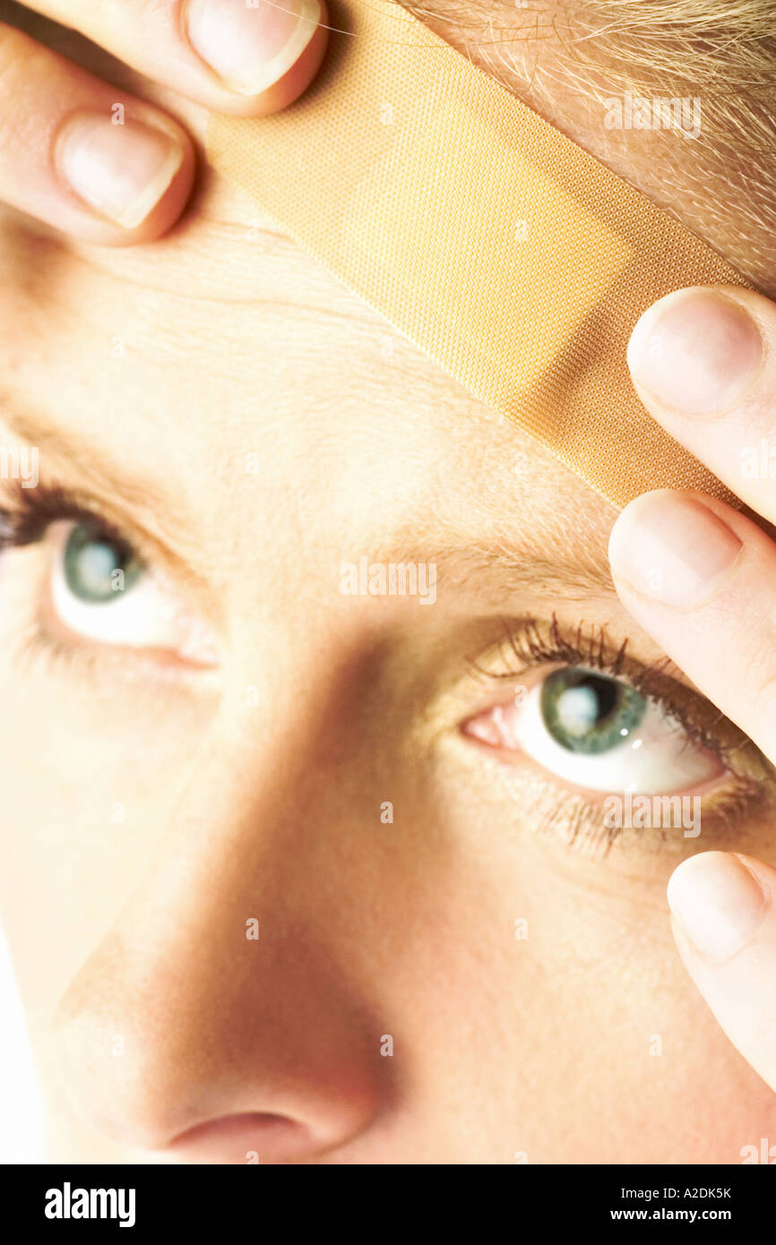 1205742 indoor studio young woman 25 30 fragment forehead head brow ...