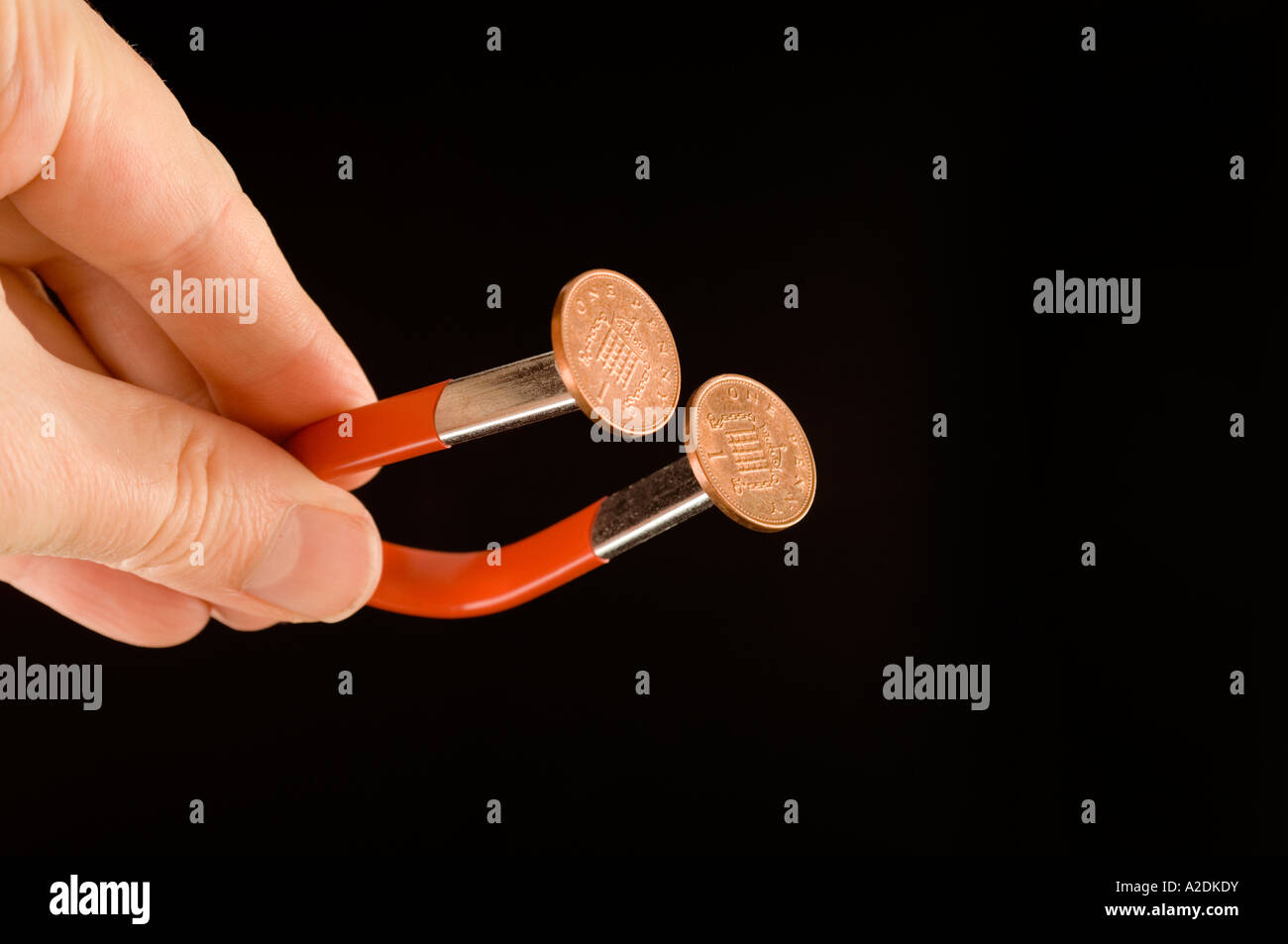 magnet with money Stock Photo - Alamy