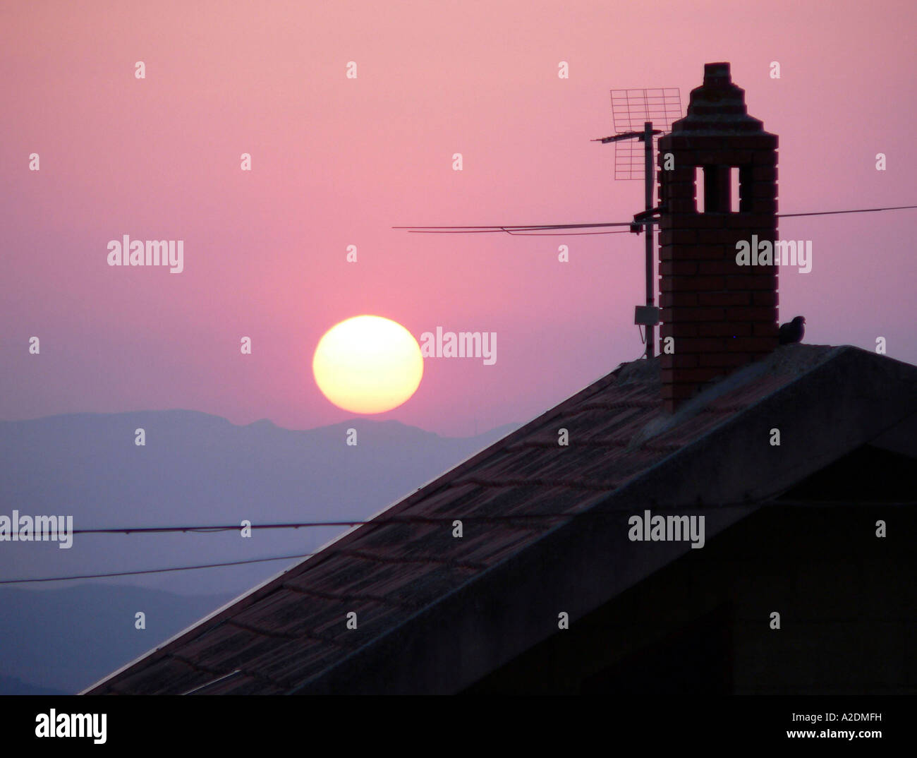 Roof, chimney and moon Stock Photo - Alamy