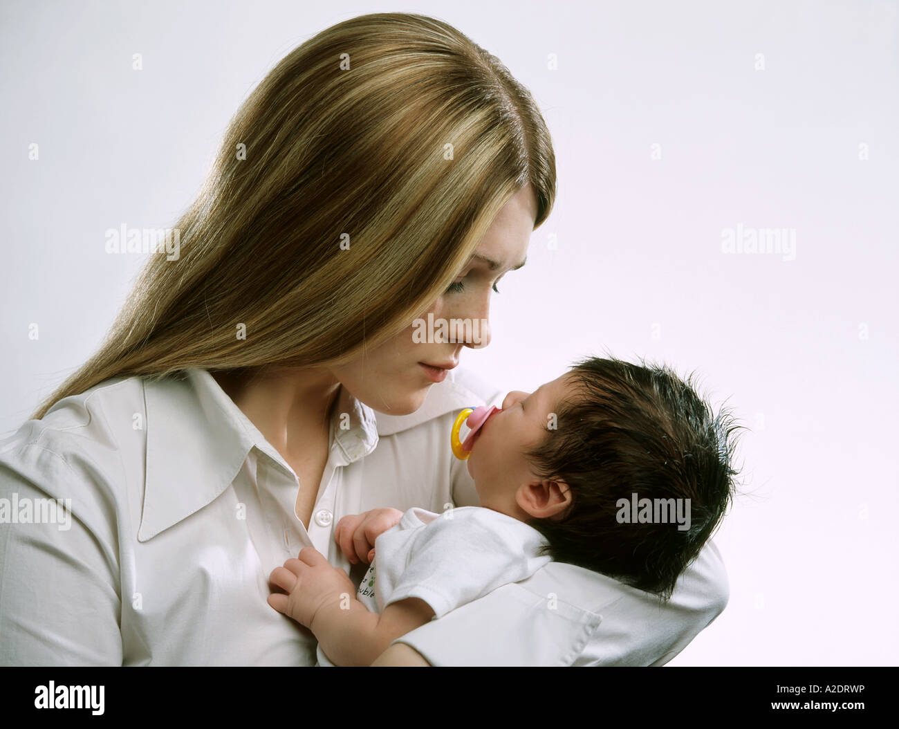 1218289 indoor studio woman young 25 30 blonde long hair baby infant ...