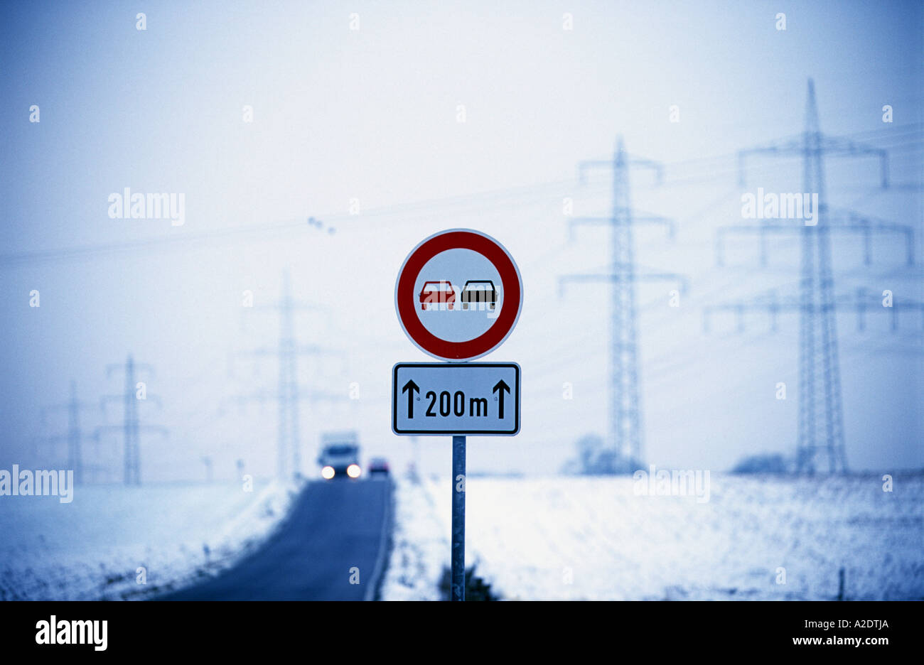 'No Passing' road traffic sign because of poor visibility due to crest ...