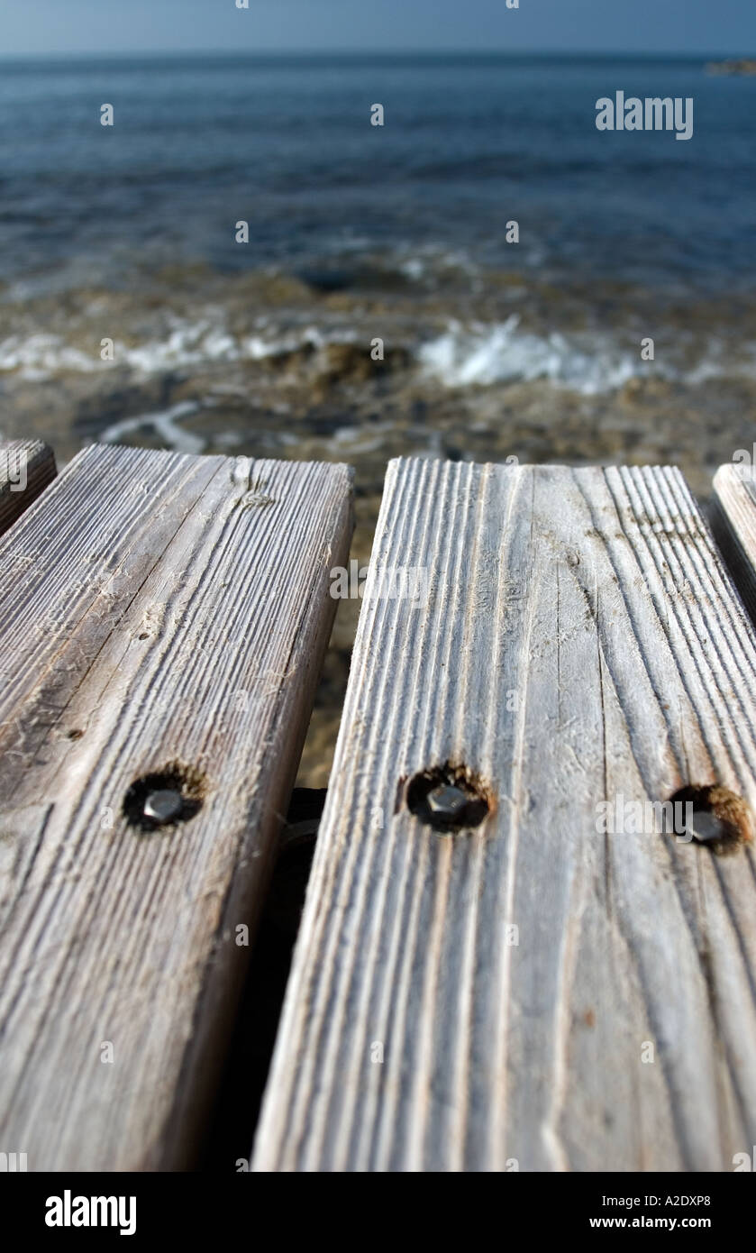 Sea washed planks of a swimming jetty Stock Photo - Alamy