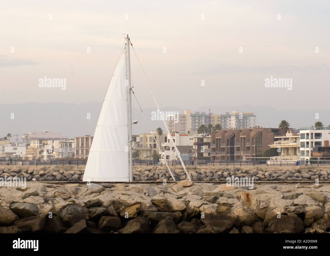 Sailing vessel between the two jetties in the channel to Marina Del Rey ...