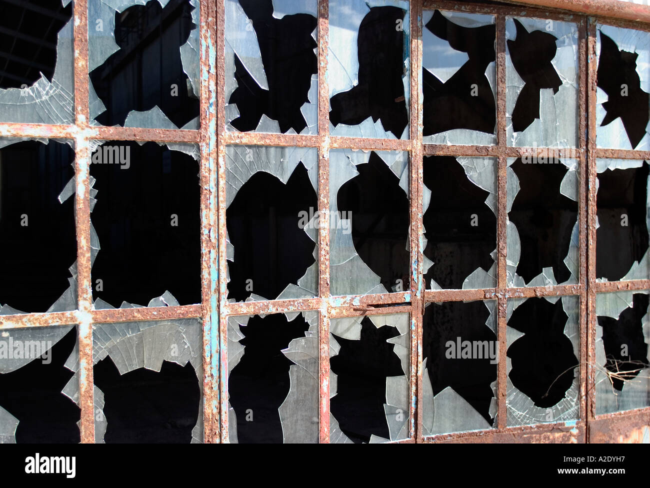 Vandalized window with broken glass panes Stock Photo - Alamy