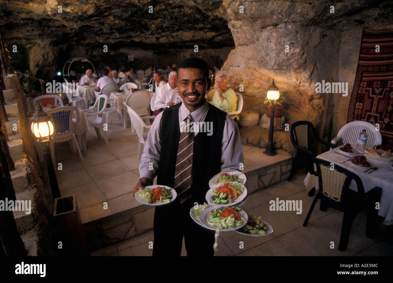 Africa, Libya, Cyrene, waiter at cave restaurant Stock Photo - Alamy