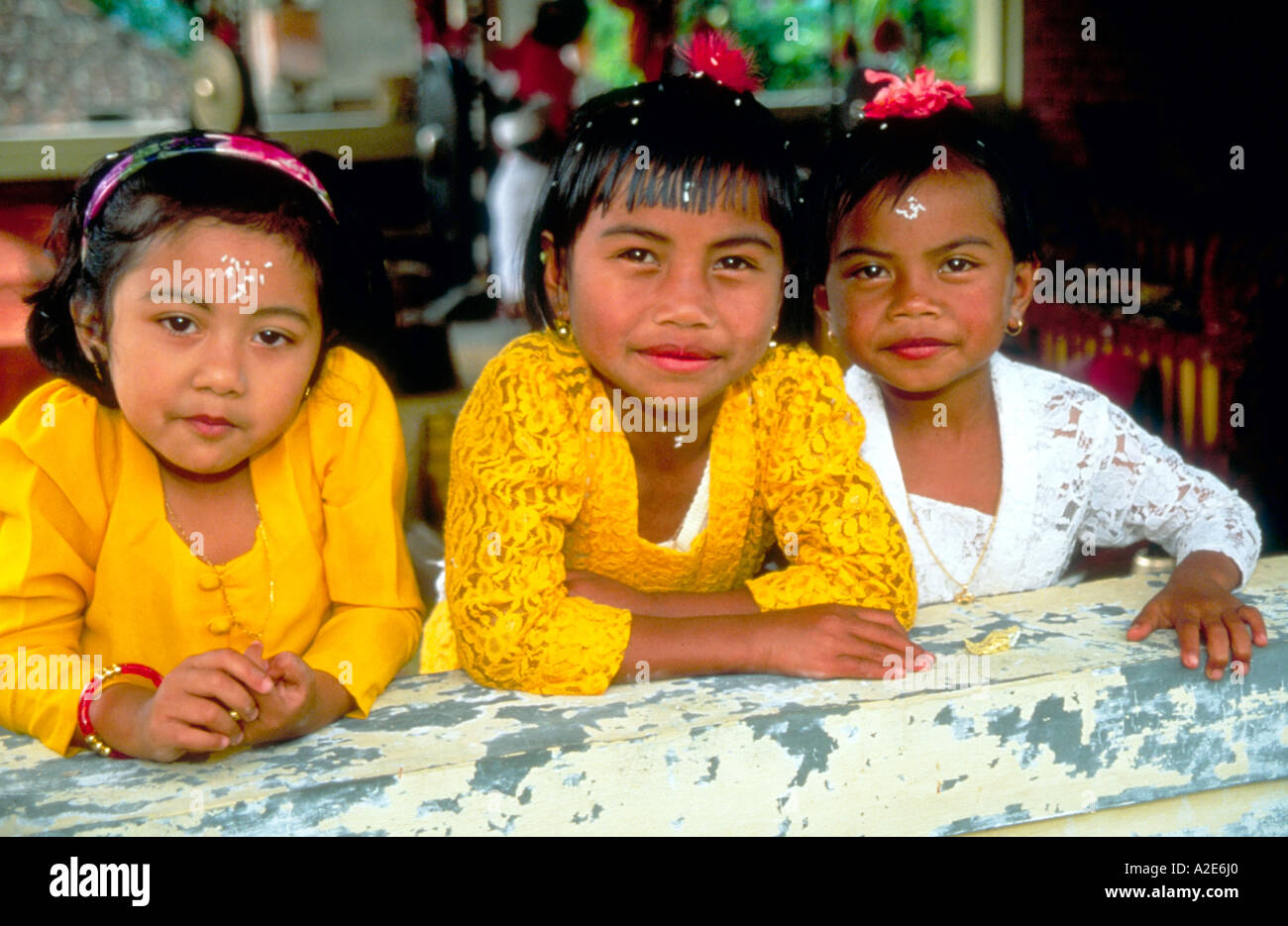 Indonesia, Bali. Girls in formal lace and silk at temple ceremony Stock ...