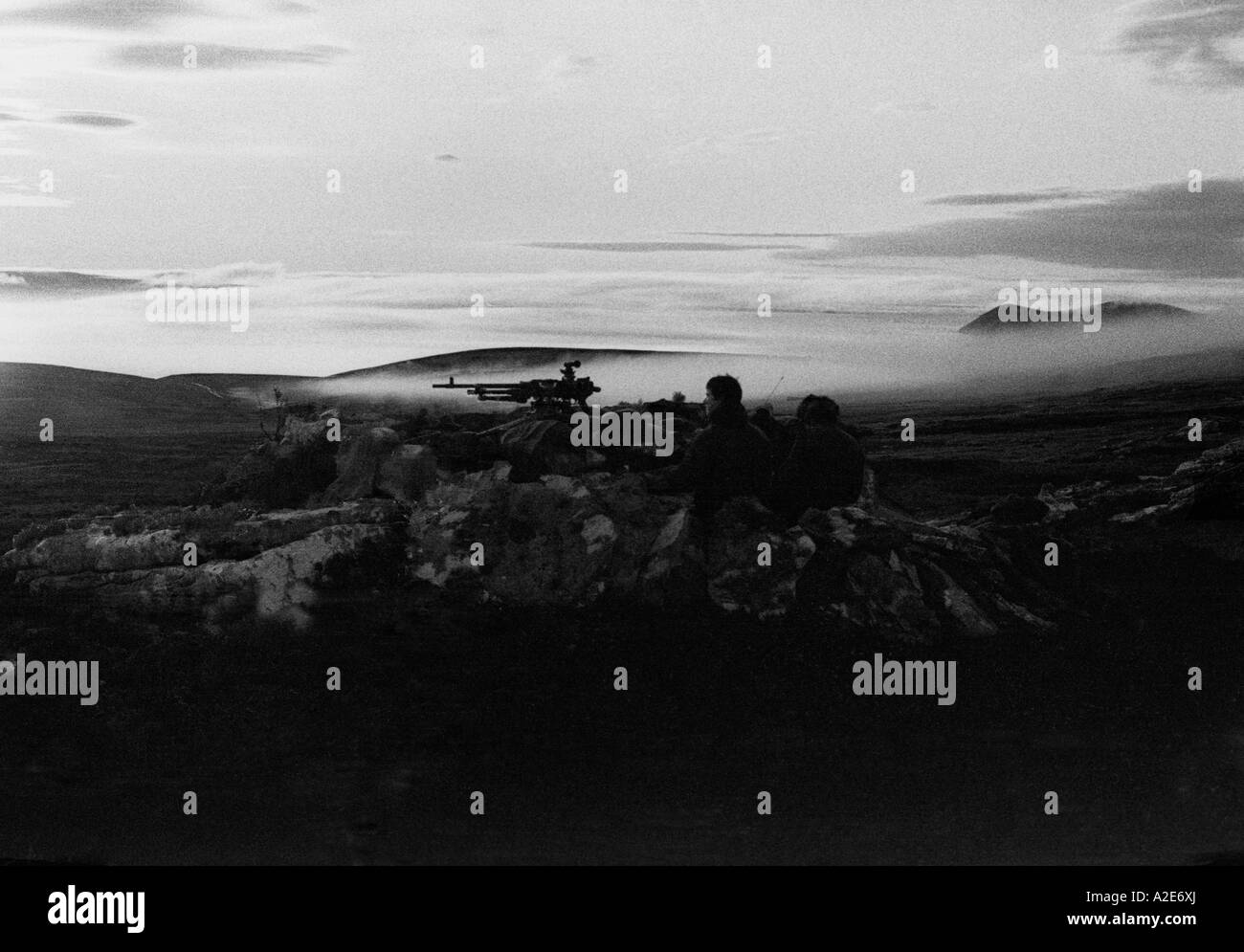 A Royal Marines Commando mans a GPMG SF position at dawn during the ...