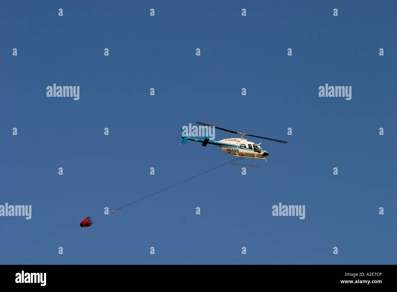 Helicopters carrying bucket water wildland hi-res stock photography and ...
