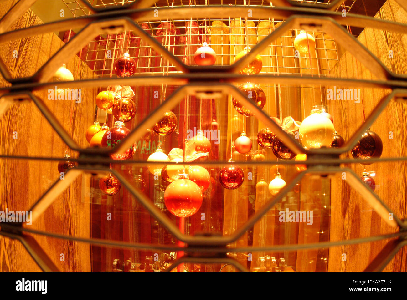 Christmas baubles hanging in a shop window Stock Photo - Alamy