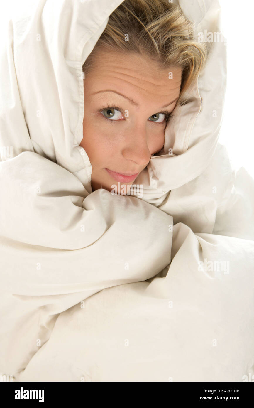 Young woman below duvet Stock Photo - Alamy