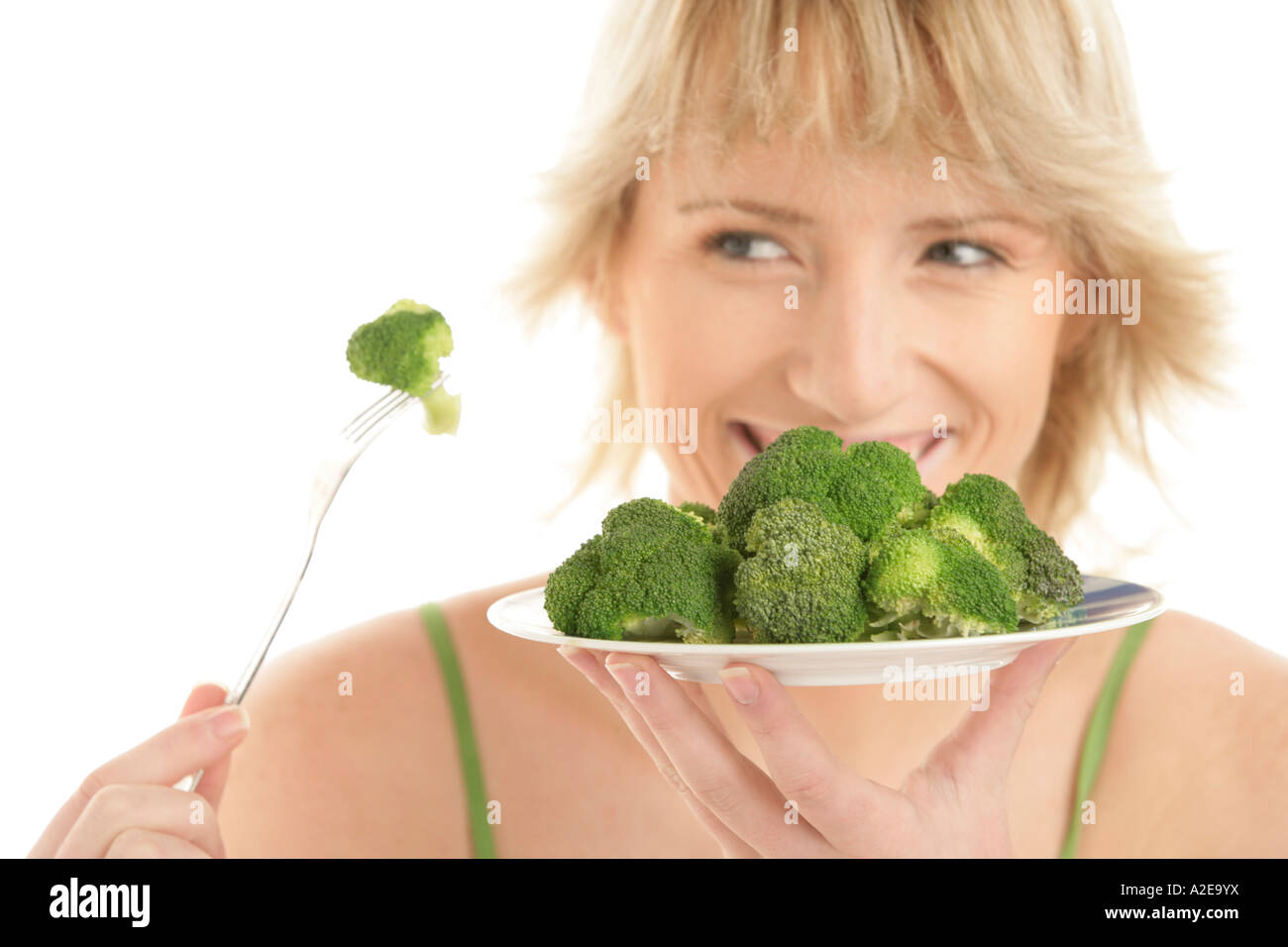 Woman with broccoli Stock Photo - Alamy