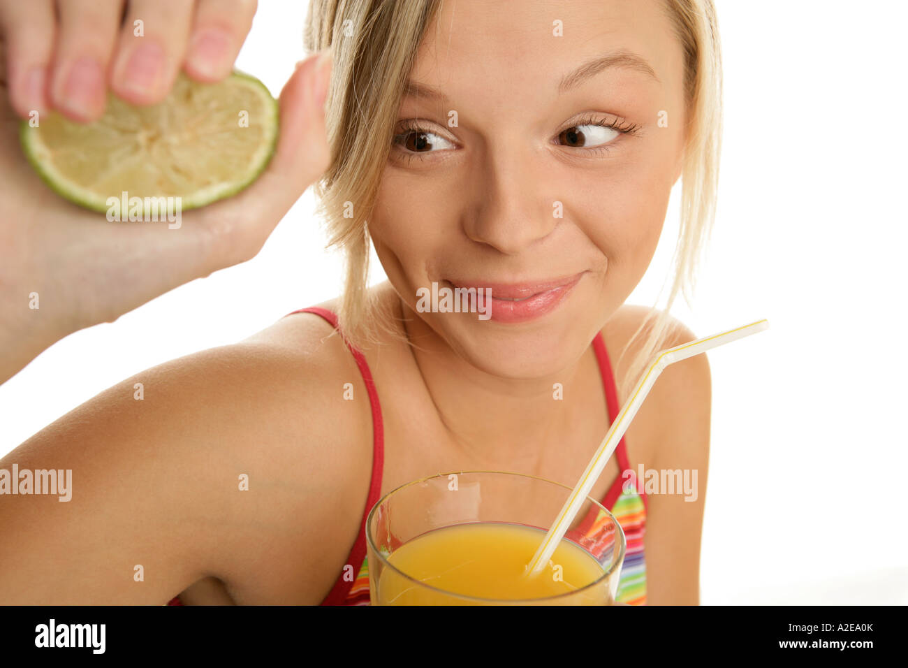 Young woman pressing lime Stock Photo - Alamy