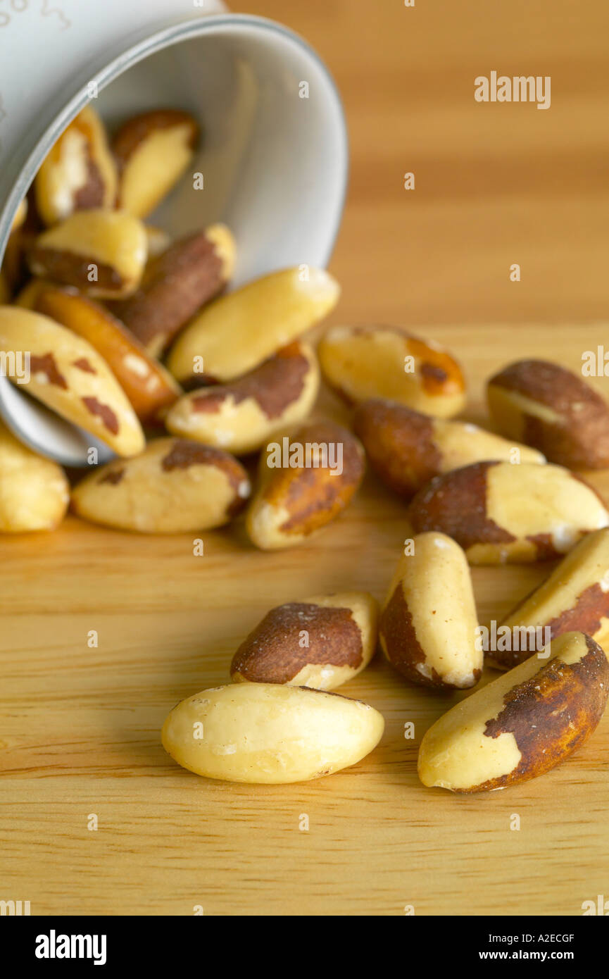 brazil nuts spilling from a pot Stock Photo - Alamy
