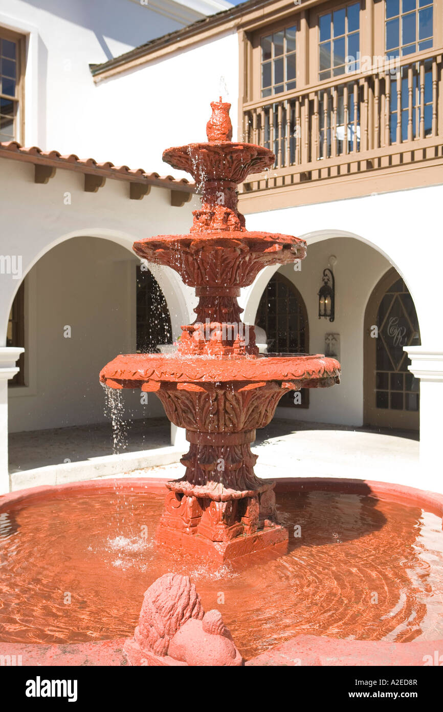 Red fountain in a plaza in Spain Stock Photo - Alamy