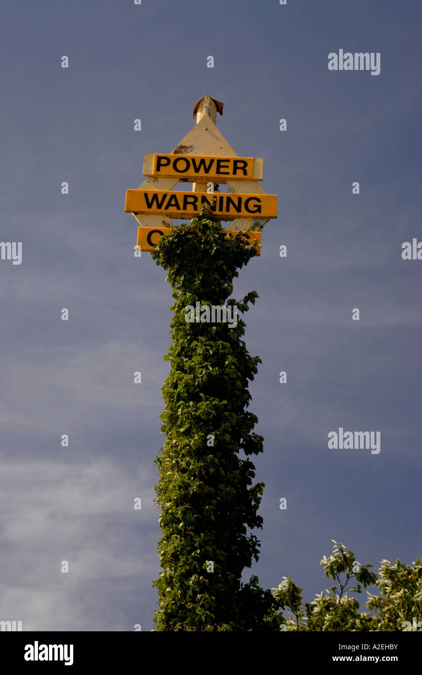 Ancient bright yellow ivy covered Hedera helix warning mark Stock Photo ...