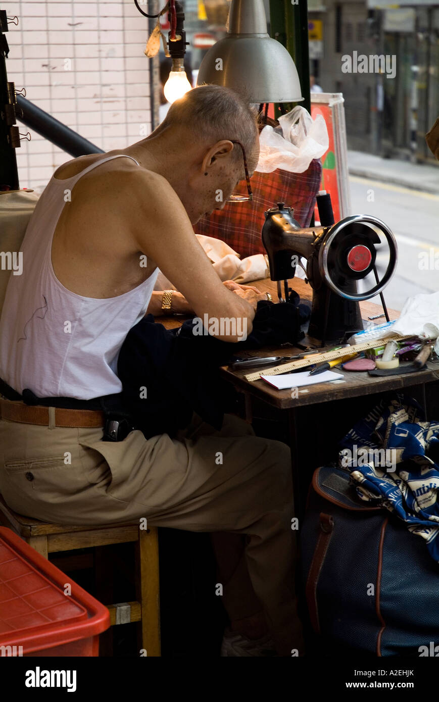dh Pottinger Street CENTRAL HONG KONG Old chinese man mending clothes ...