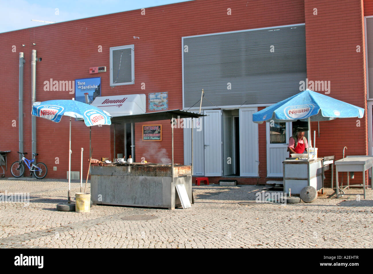 Outdoor kitchen at a Fish Restaurant fishing harbour Portimao Algarve ...