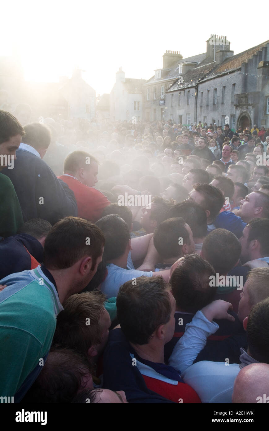 dh The Ba KIRKWALL ORKNEY Steaming pack of Ba players and spectators in ...