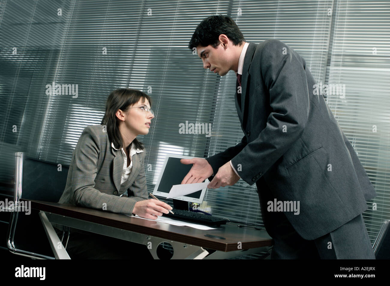 1220048 indoor office work couple young woman man 25 30 suit suits tie ...