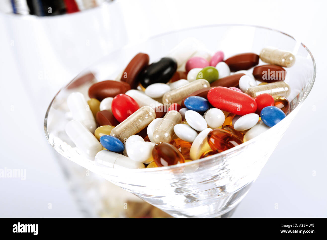 Pills in cocktail glass, close-up Stock Photo - Alamy