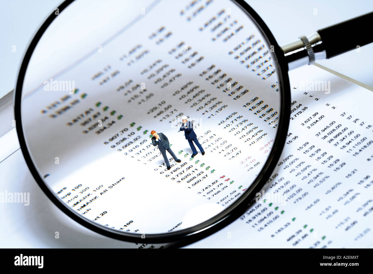 Magnifying glass, quotations sheet and figurines Stock Photo - Alamy