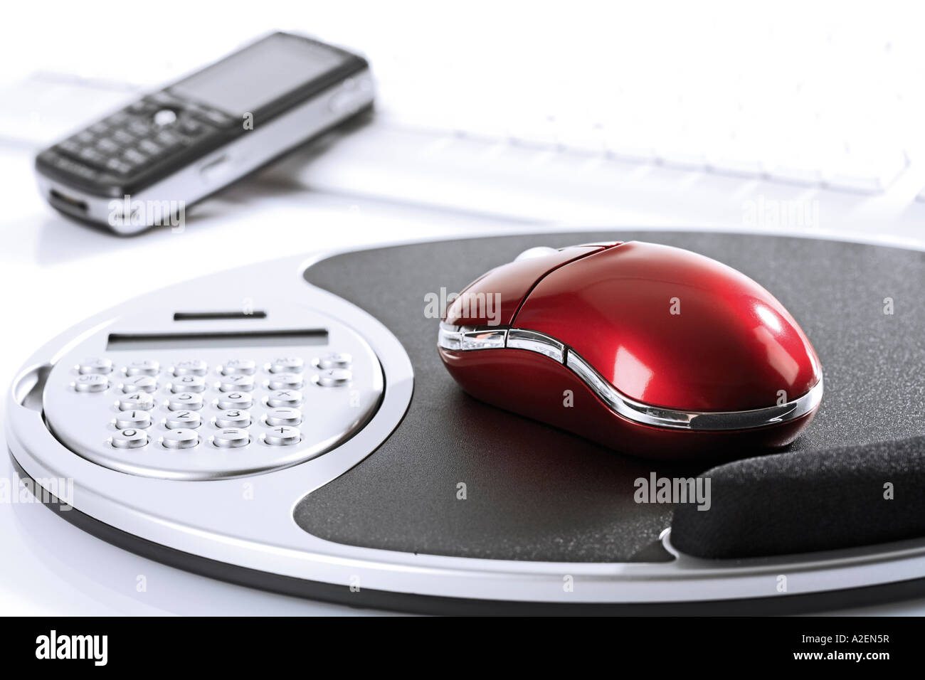 Mouse on mousepad with calculator Stock Photo - Alamy
