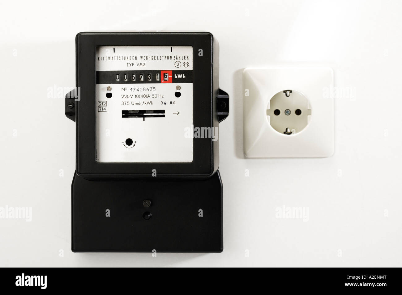 Electricity meter and socket, close-up Stock Photo - Alamy