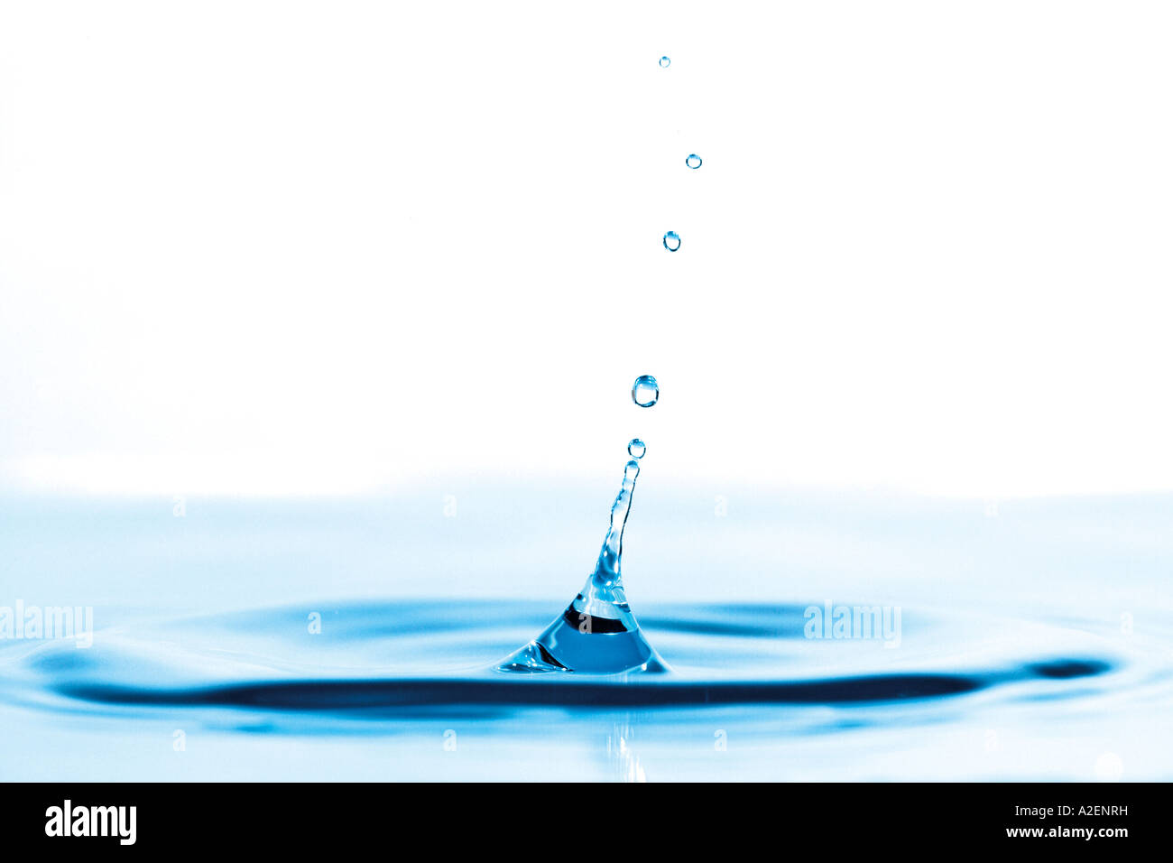 Water drop falling into water, close-up Stock Photo - Alamy