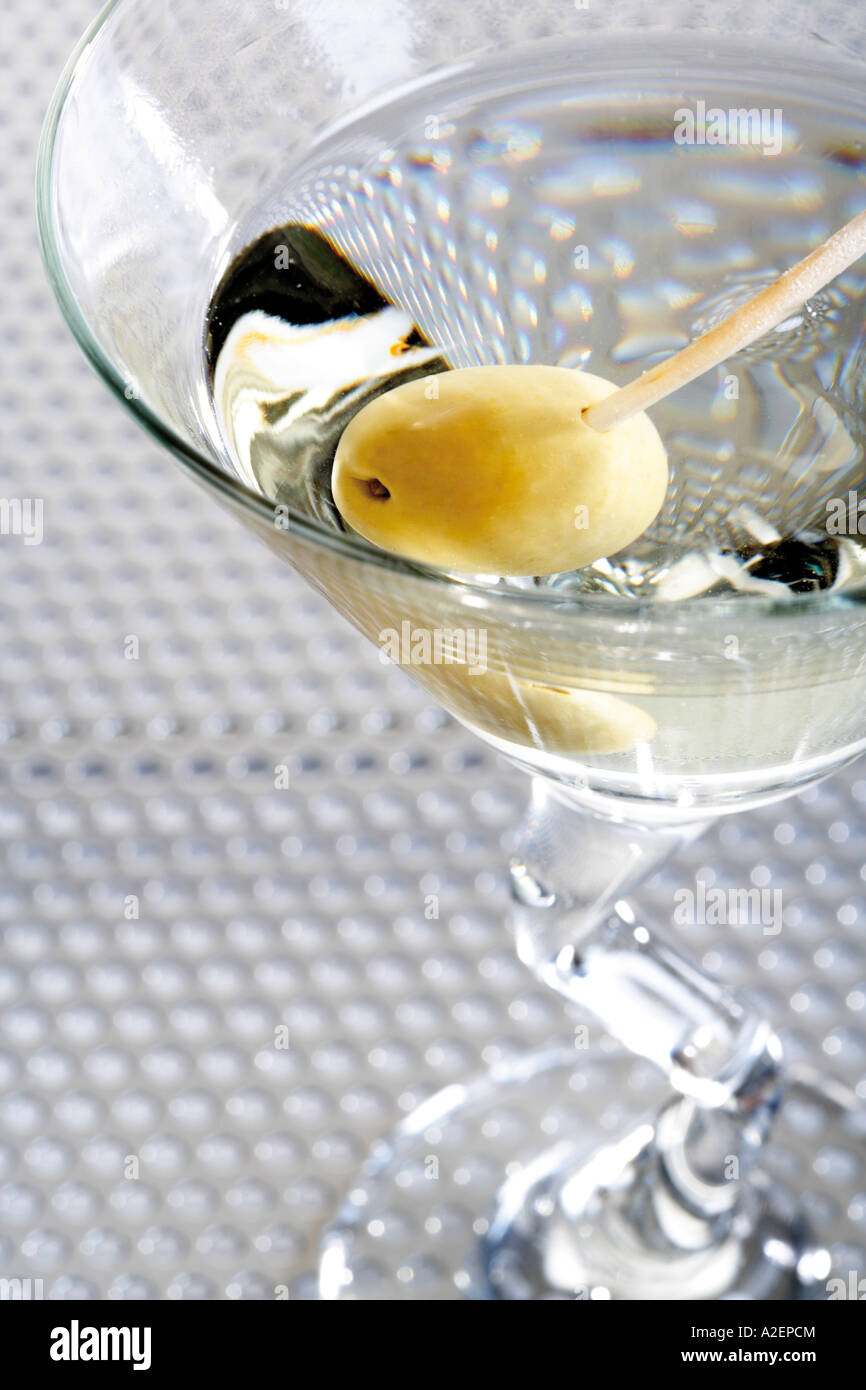Glass of Martini with green olive, close-up Stock Photo - Alamy