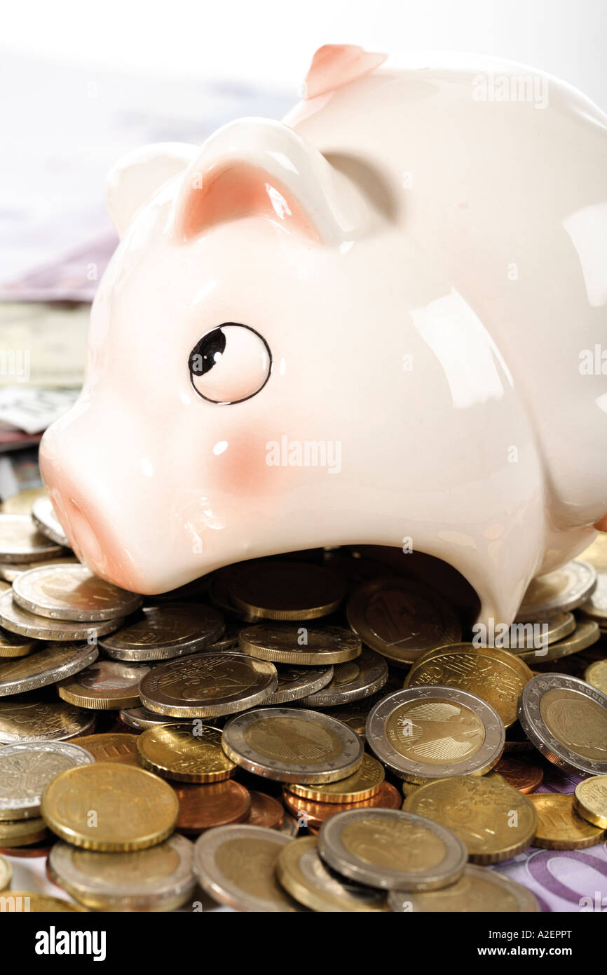 Piggy bank eating coin hi-res stock photography and images - Alamy