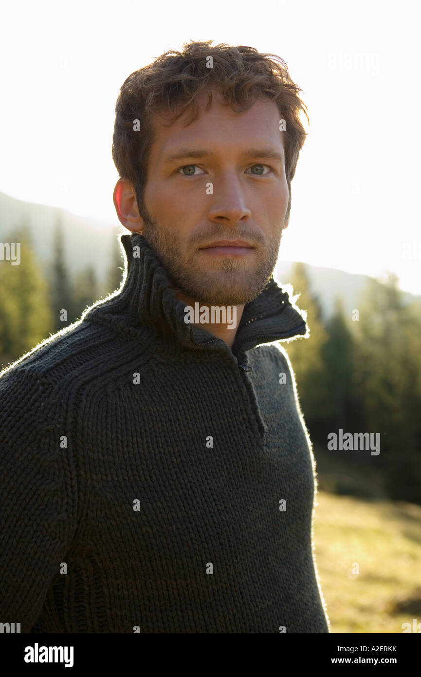 Germany, Bavaria, young man standing outdoors, portrait Stock Photo - Alamy