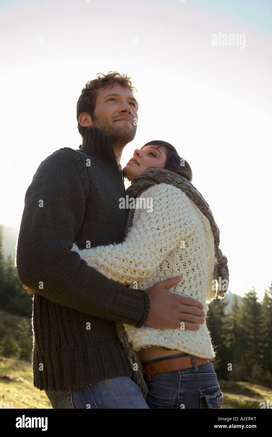 Young couple embracing, low angle view Stock Photo - Alamy