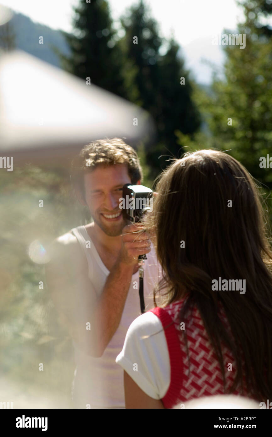 Young man filming young woman, close-up Stock Photo - Alamy