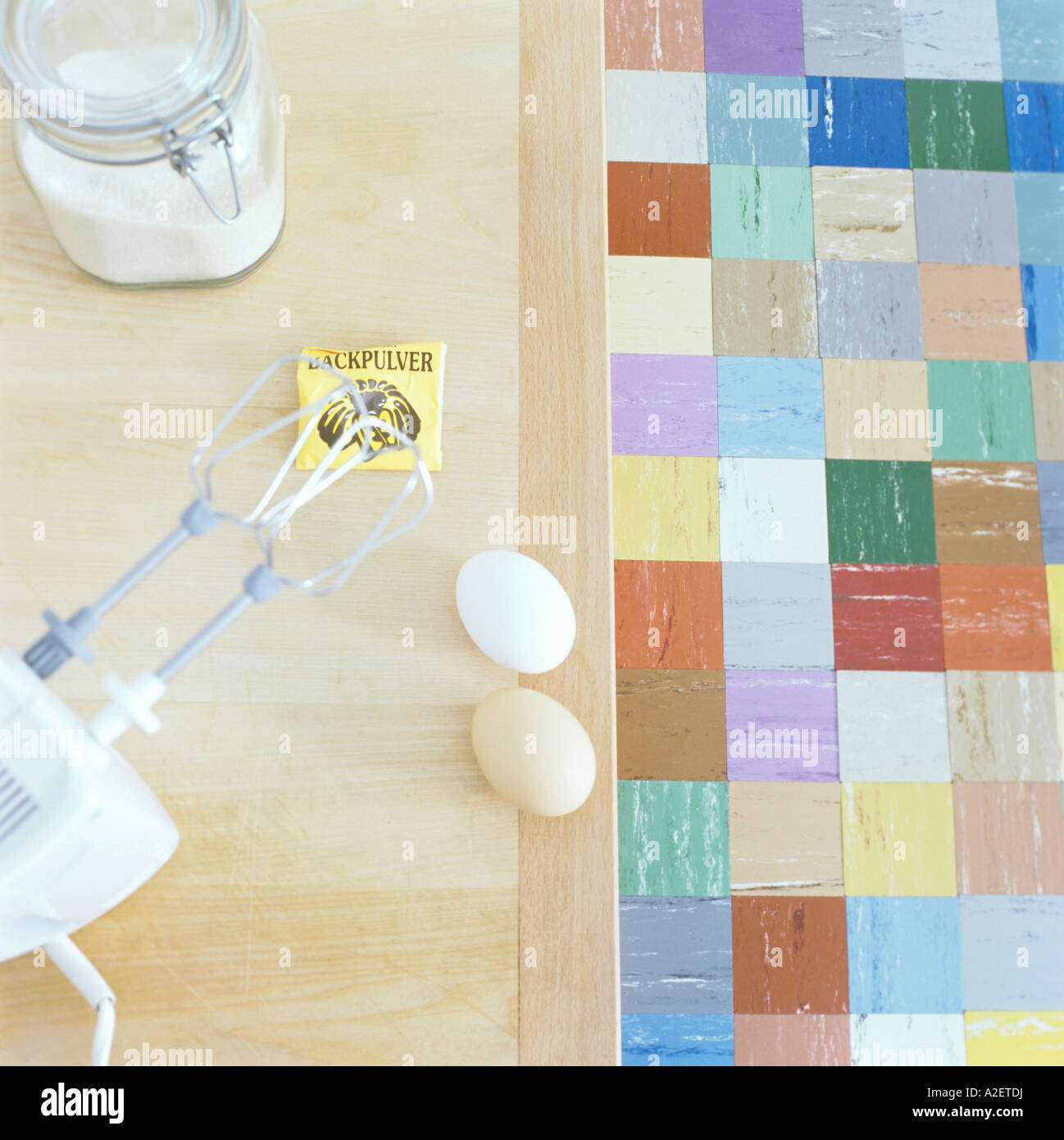 Electric mixer, eggs, flour and baking powder on kitchen table Stock ...