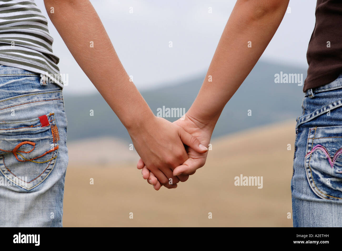 Holding hands, close-up Stock Photo - Alamy Holding hands, close-up Stock Photo - Alamy