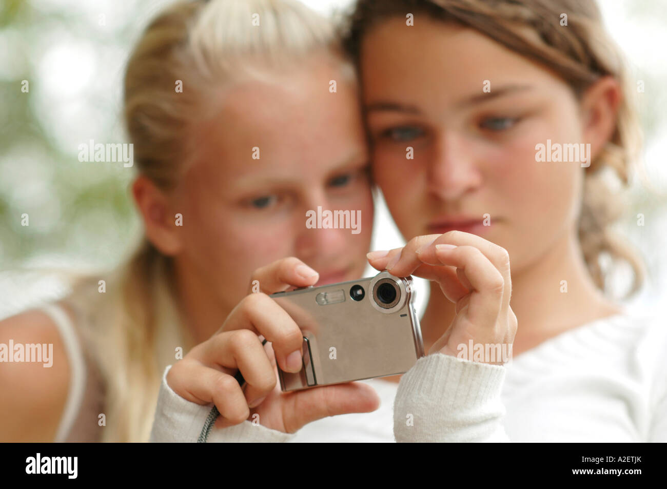Girls with digital camera, close-up Stock Photo - Alamy