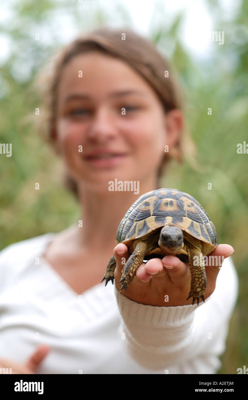 Teenage girl holding turtle, portrait Stock Photo - Alamy