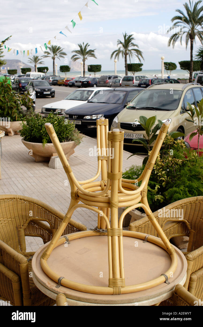 Upturned wicker table at seafront cafe Altea Costa Blanca Spain Stock ...