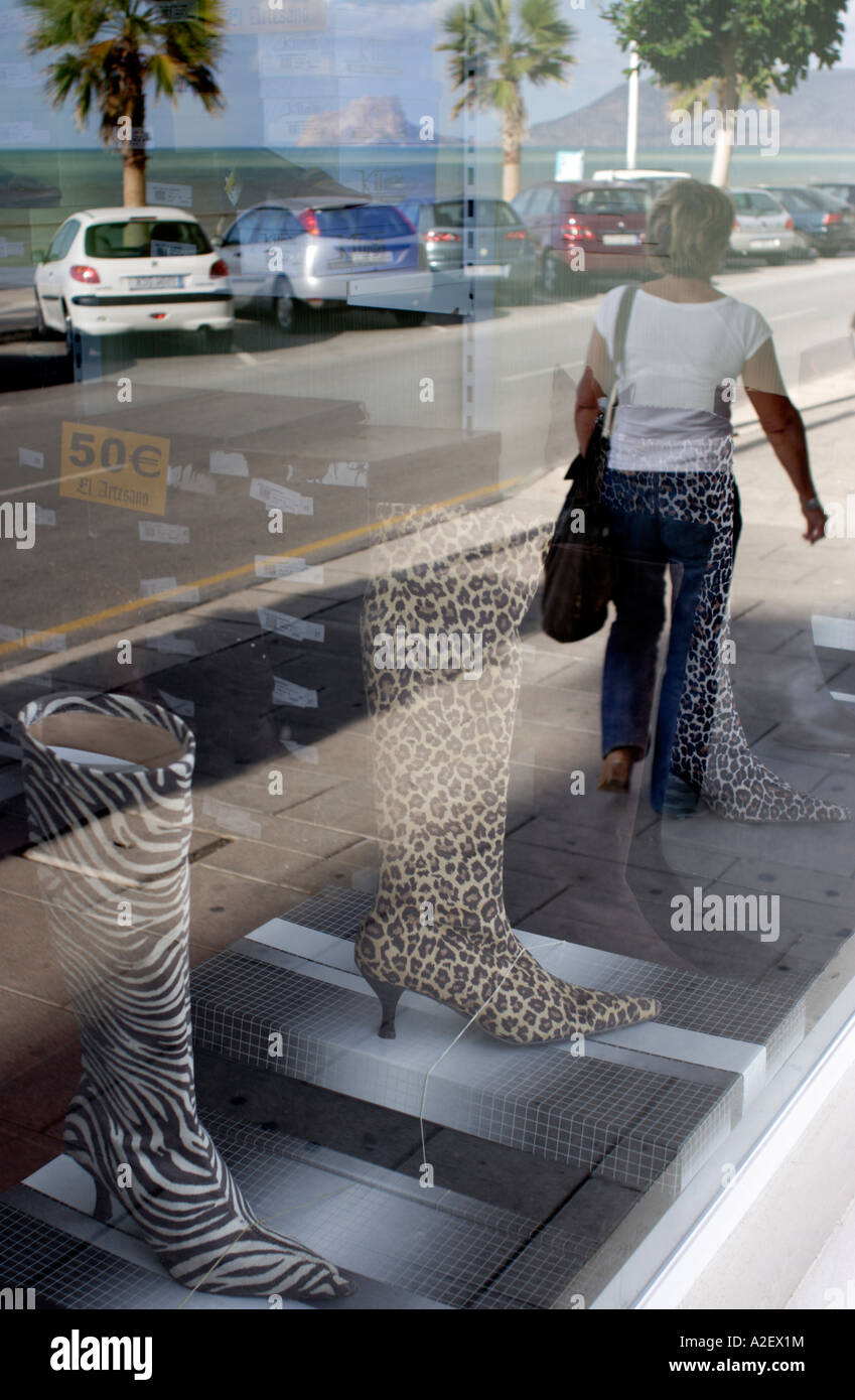 Womens calf length fashion animal skin boots on display in shoeshop ...