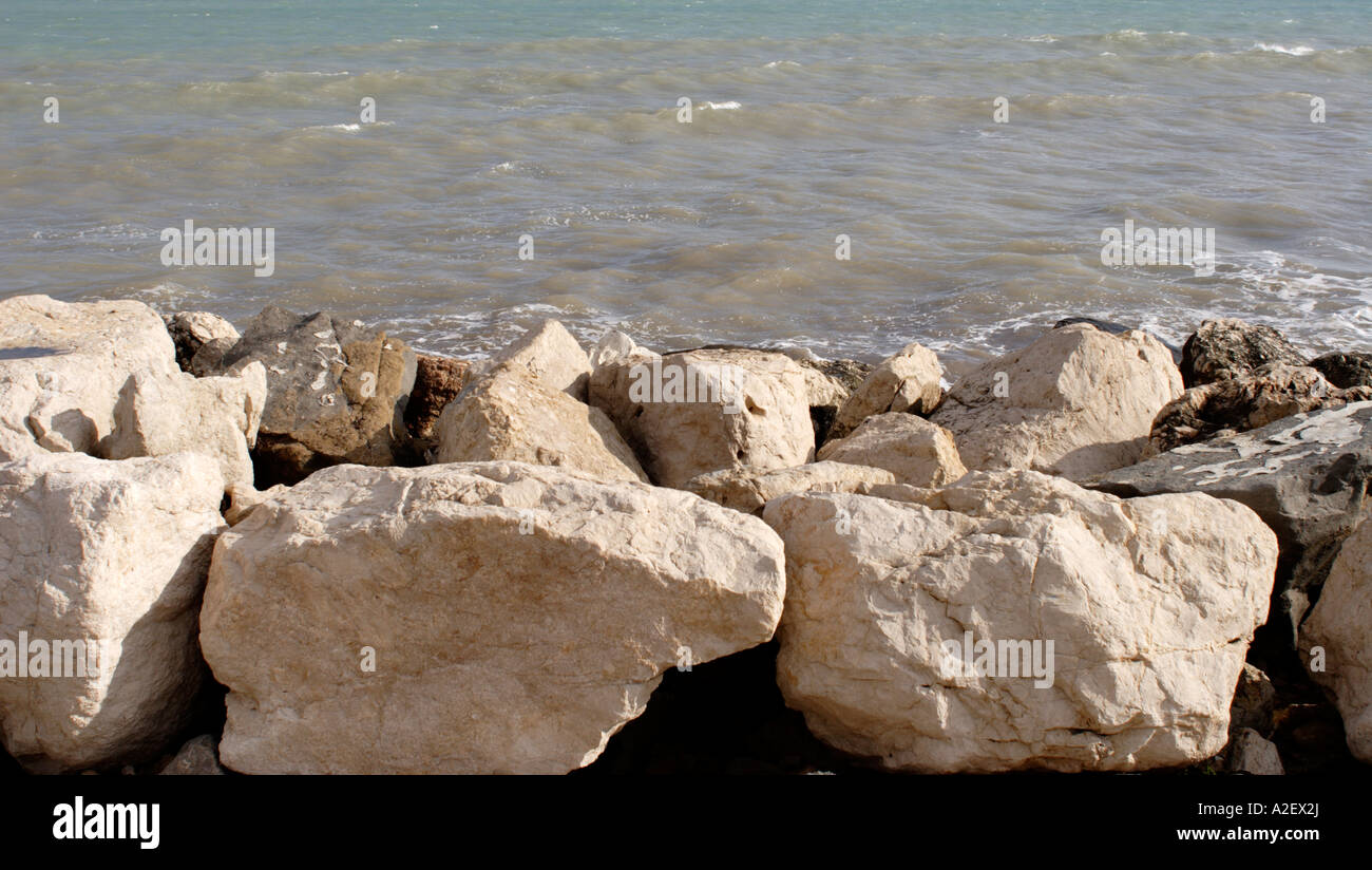 Rocks placed on sea shore to prevent erosion Stock Photo - Alamy
