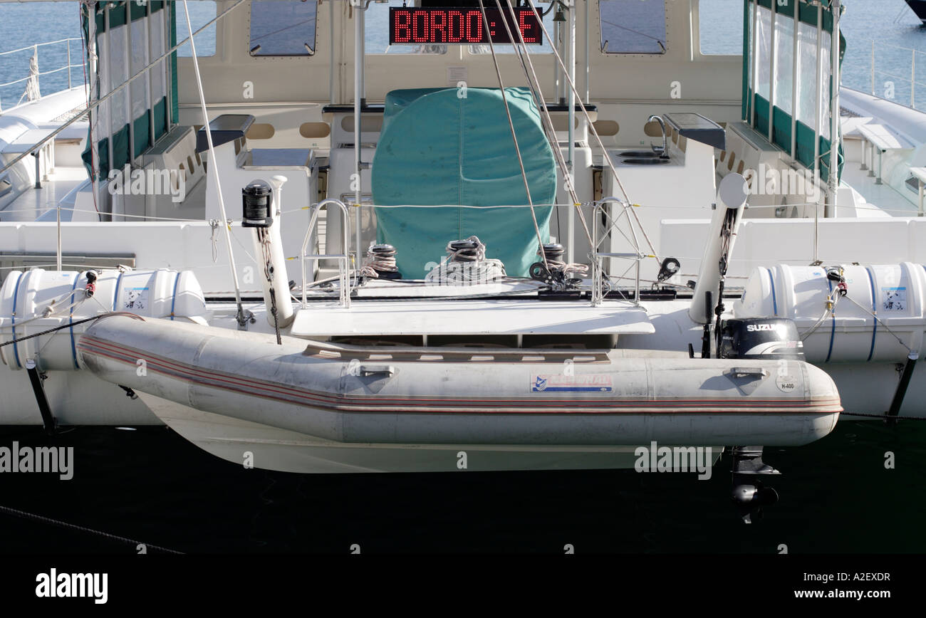 Inflatable speed boat slung on stern of ocean goung motor yaucht Stock ...