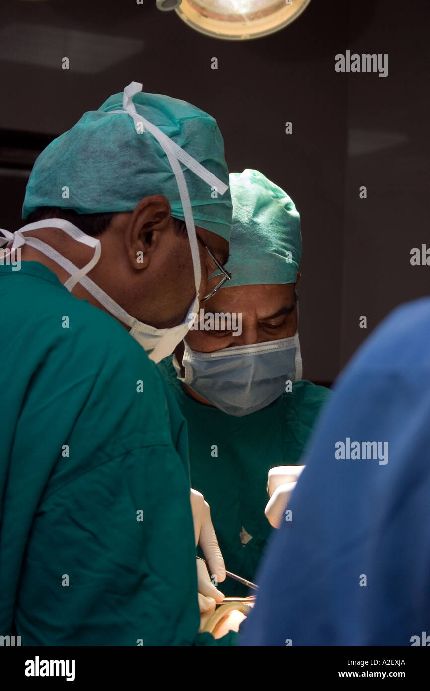 Surgeons at work inside an operation theater Stock Photo - Alamy