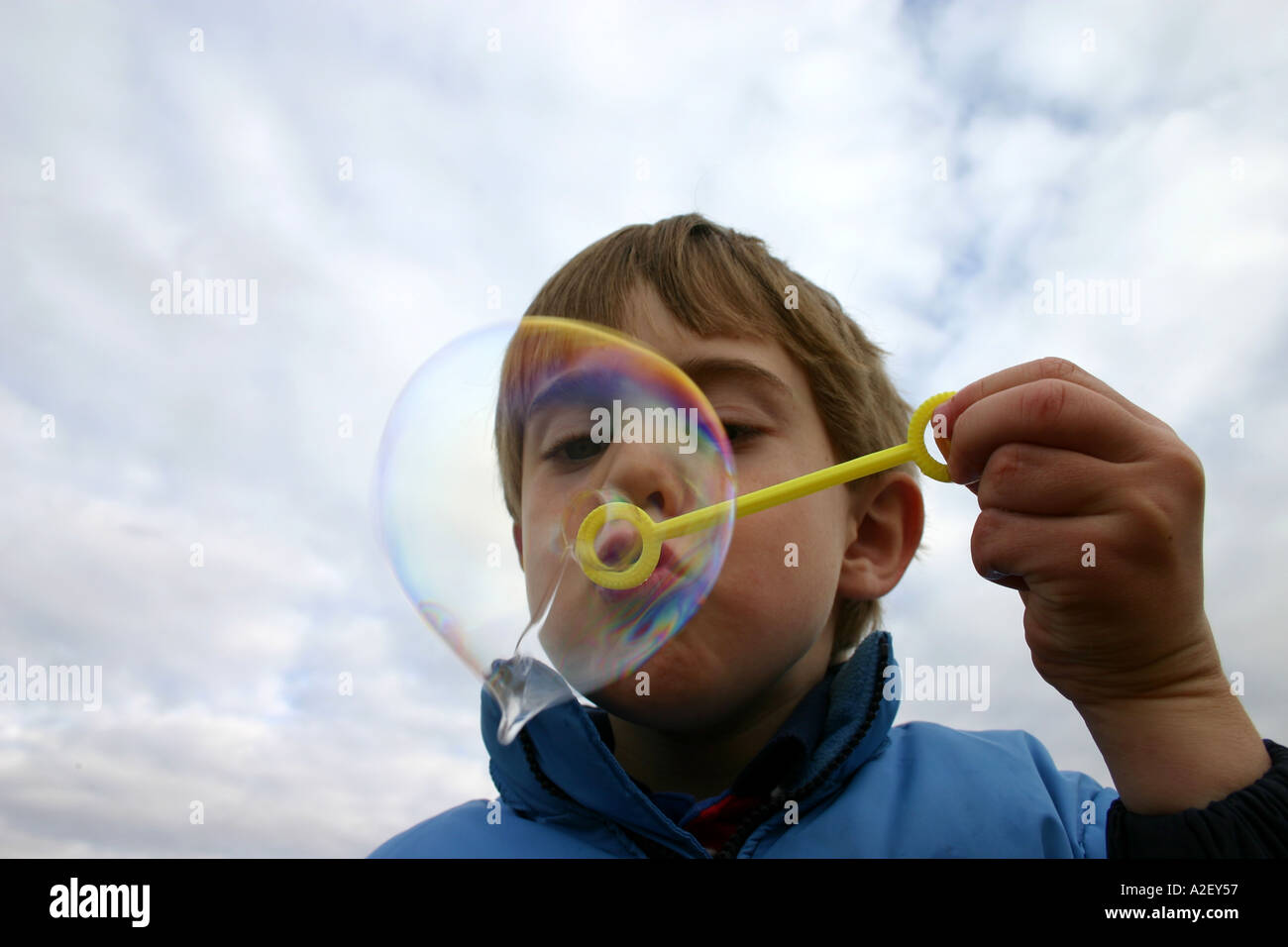child blowing bubble with sky Stock Photo - Alamy