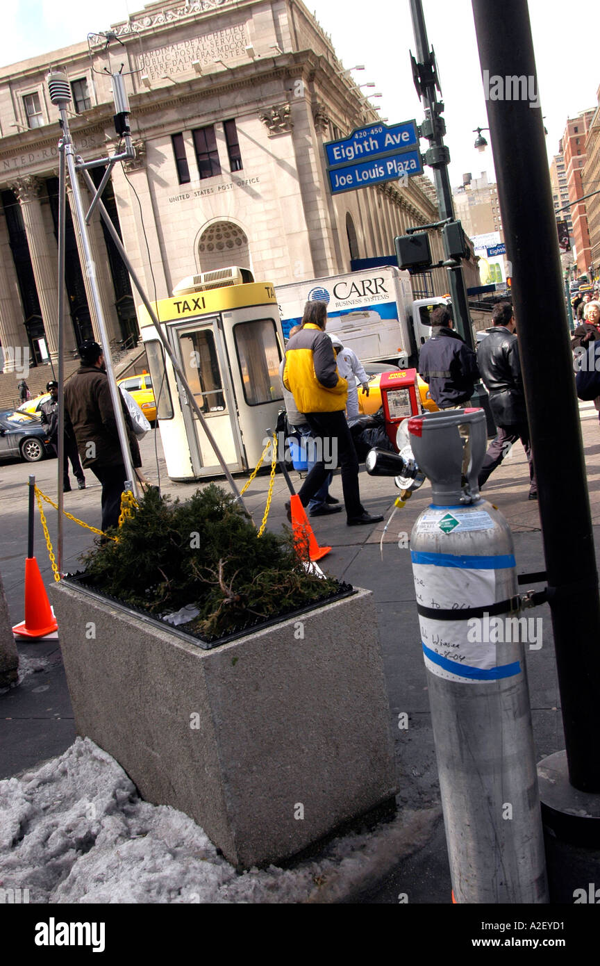 Commuters rush by a tank of Perflourocarbon PFC gas in front of ...