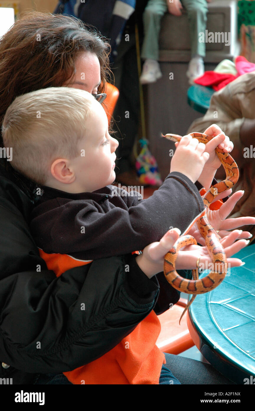 Boy with snake hi-res stock photography and images - Alamy