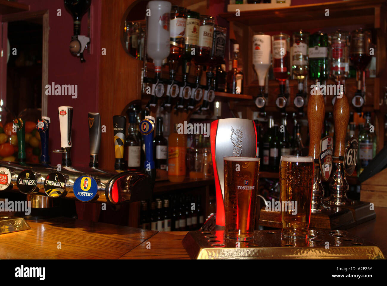 Pub bar with pints of beer on the counter in England, UK Stock Photo ...