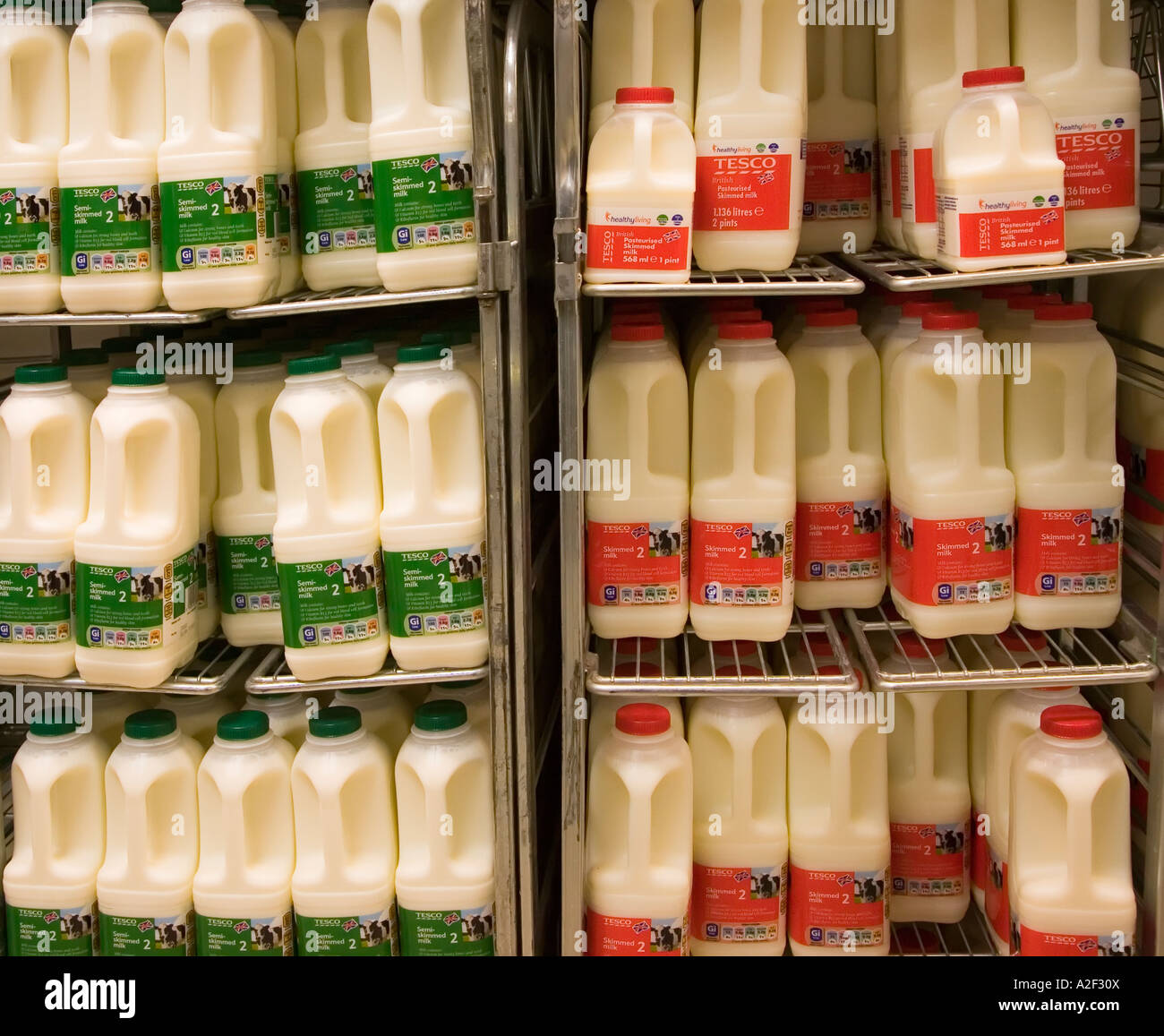 Skimmed and semi skimmed milk on sale in supermarket UK Stock Photo - Alamy