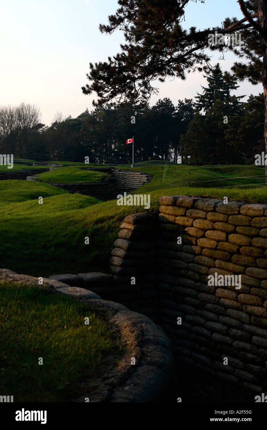The Canadian flag flies over the trenches at the Vimy Ridge memorial to ...